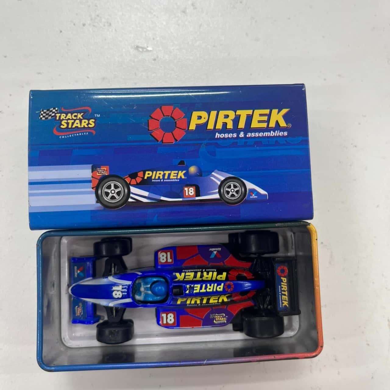 Hot Wheels Track Stars Pirtek Car in Tin