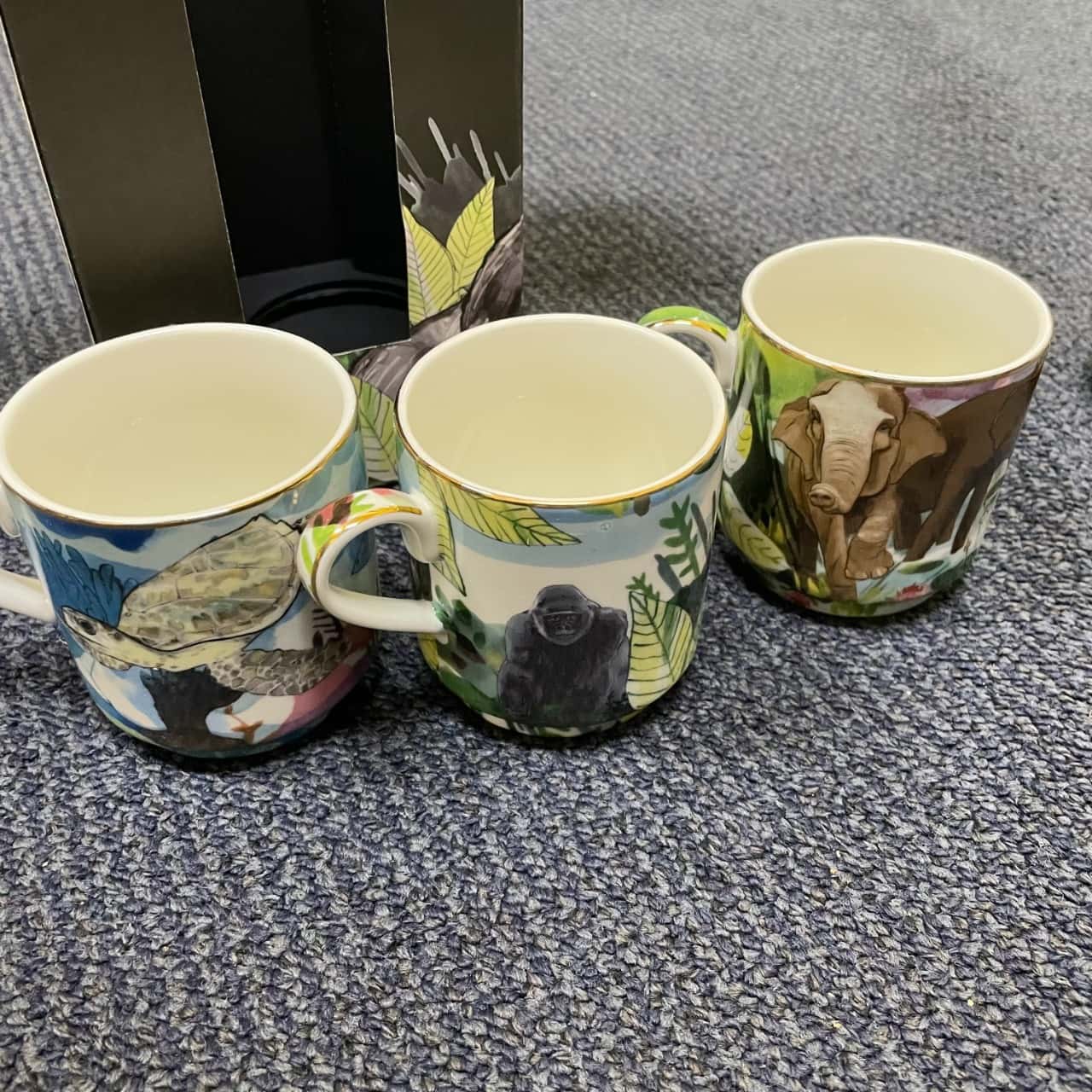 T2. Trio of stackable mugs/ Wild for life. In original box.(s)