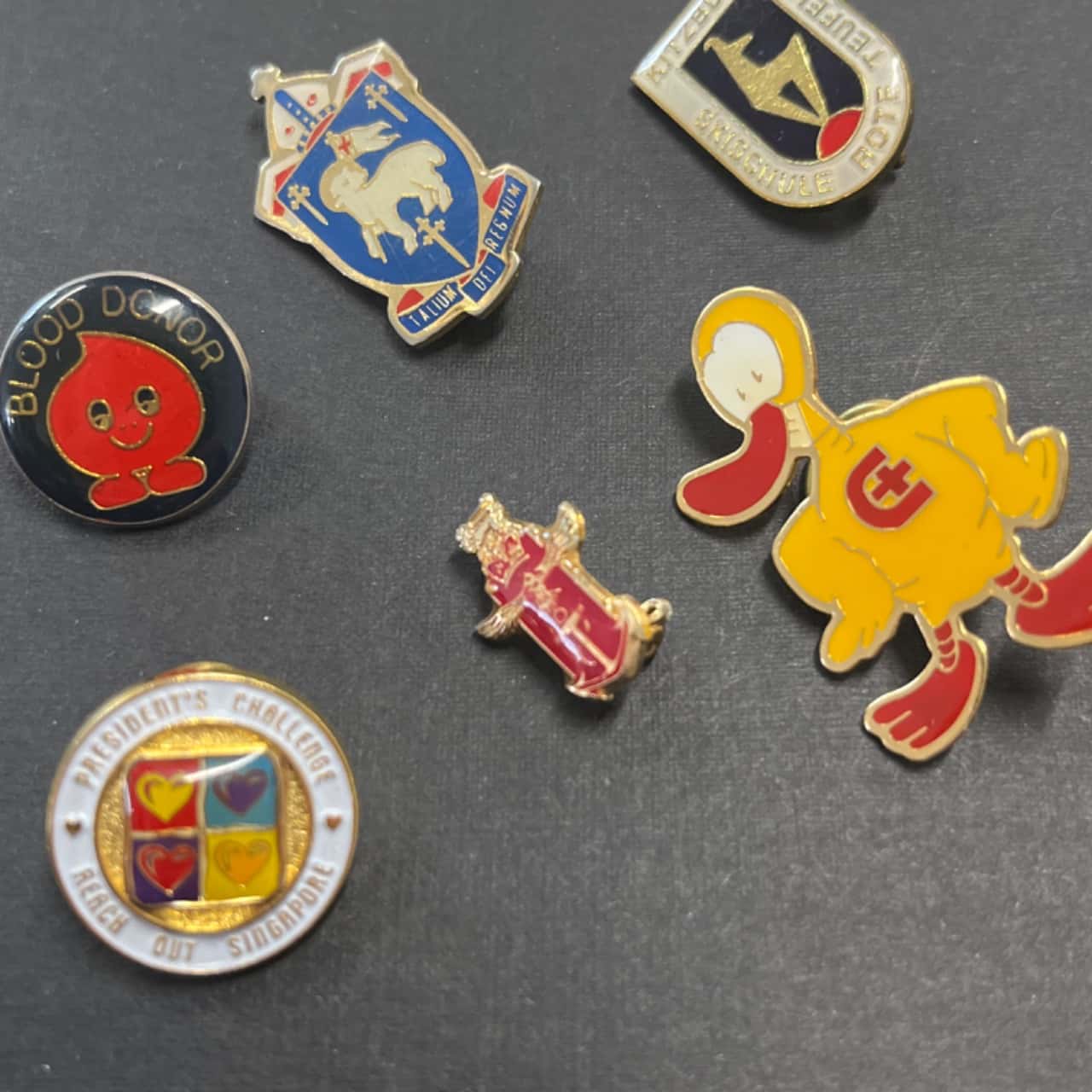 Collection of quirky badges pins