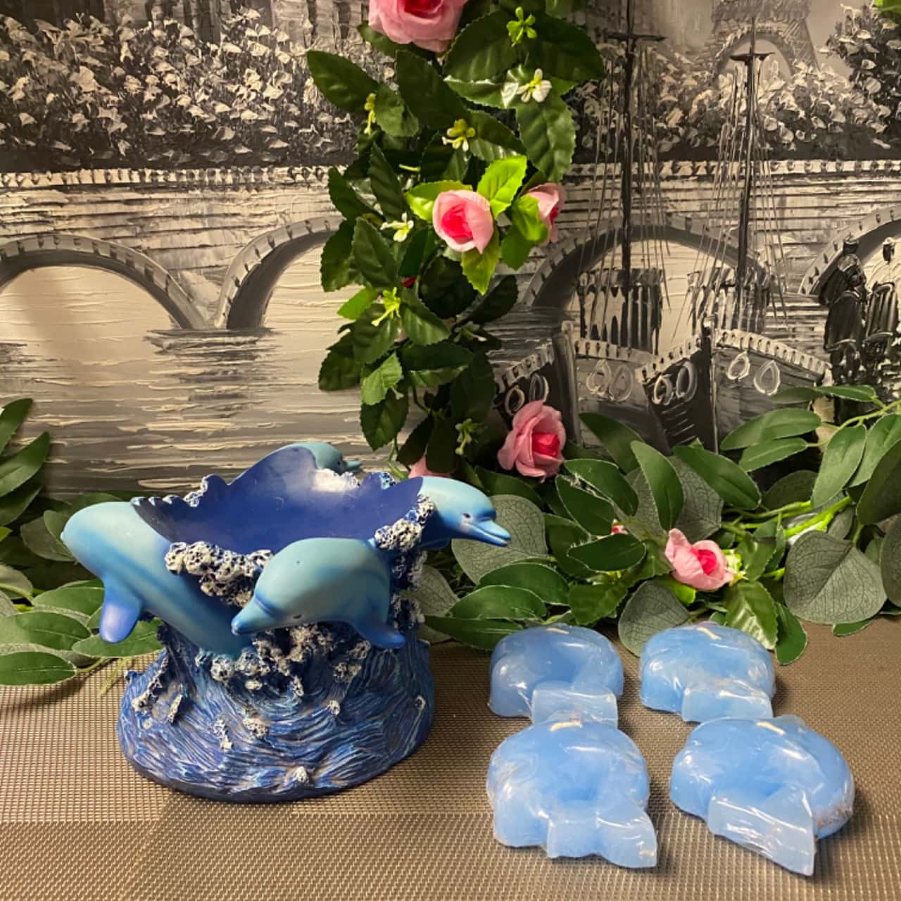 Dolphin statue candle holder