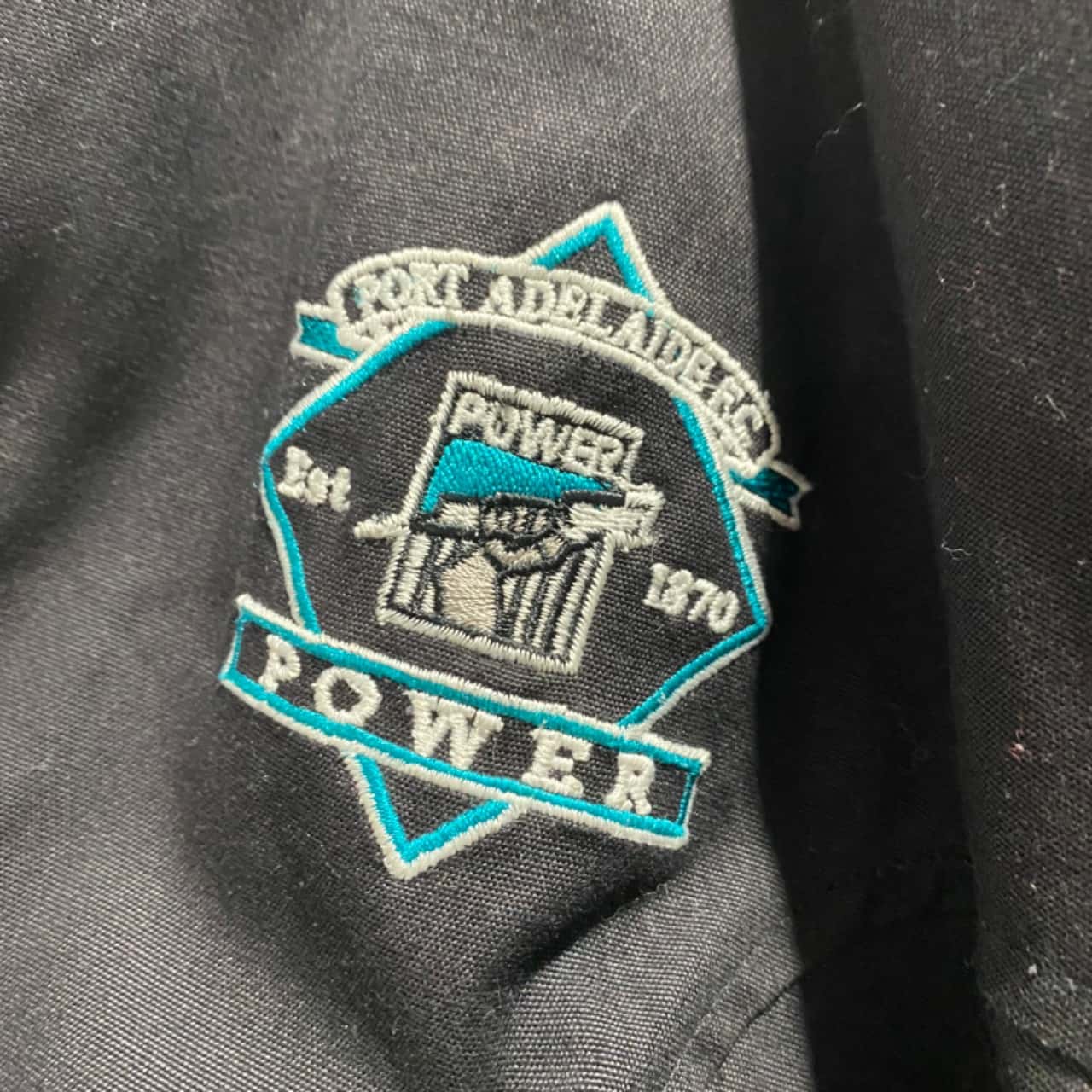 AFL - Port Adelaide. Unisex. Size M Black Vintage Padded Bomber Jacket ...