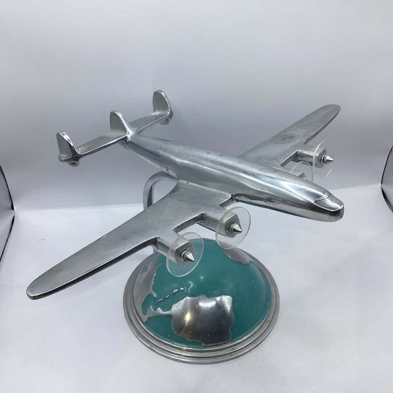 Chrome Propeller Plane Stand on Half a Globe