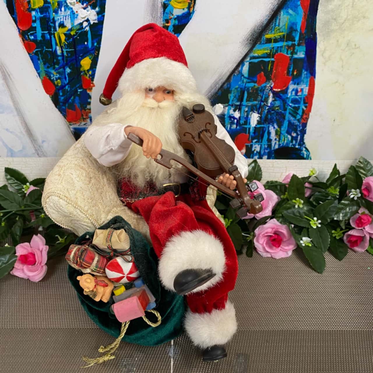 Battery operated Animated reclining/playing fiddle Santa (s)