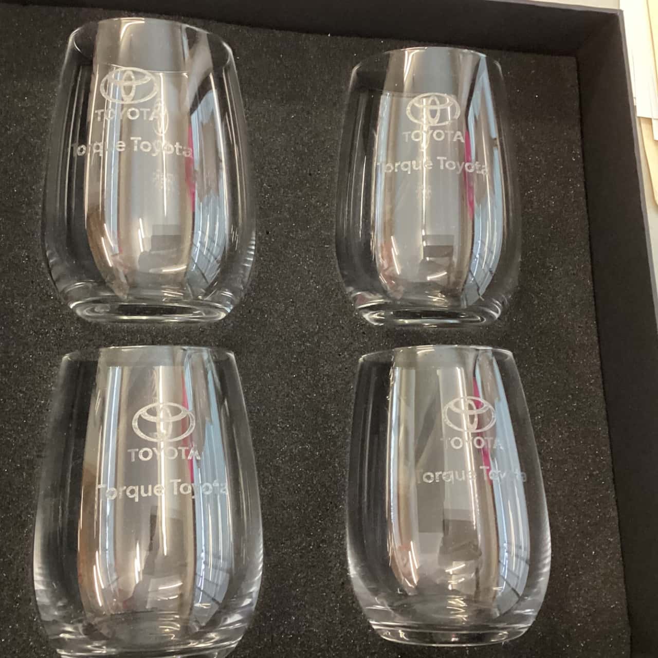Set of four Torque Toyota Etched Glasses in original box