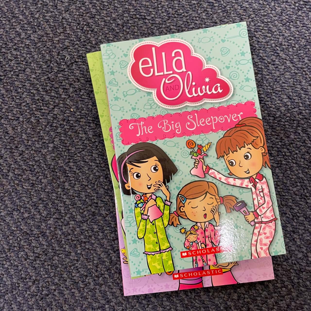 Ella and Olivia. 8 soft cover books in cardboard case. Good condition(s)