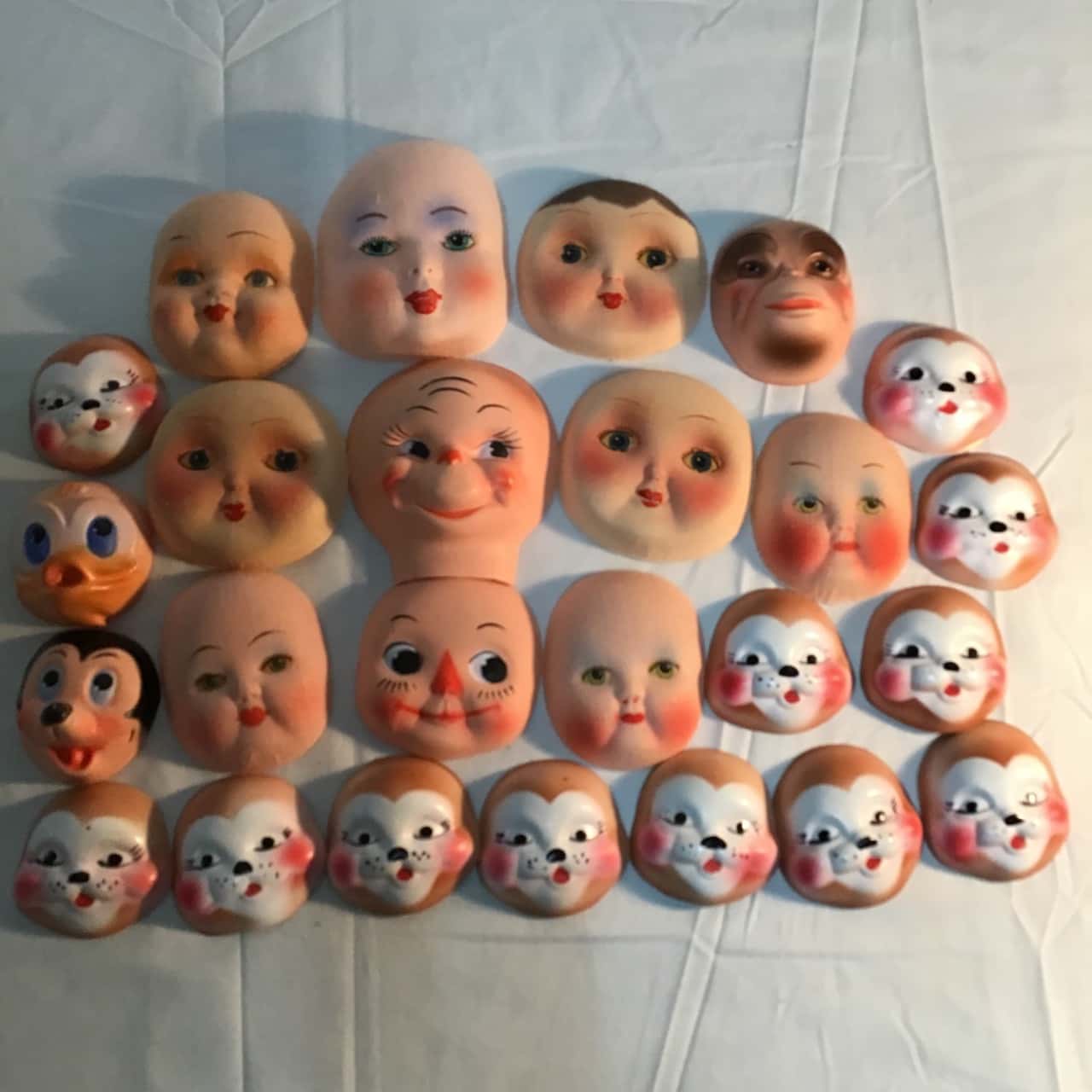 25 assorted Doll faces(s)