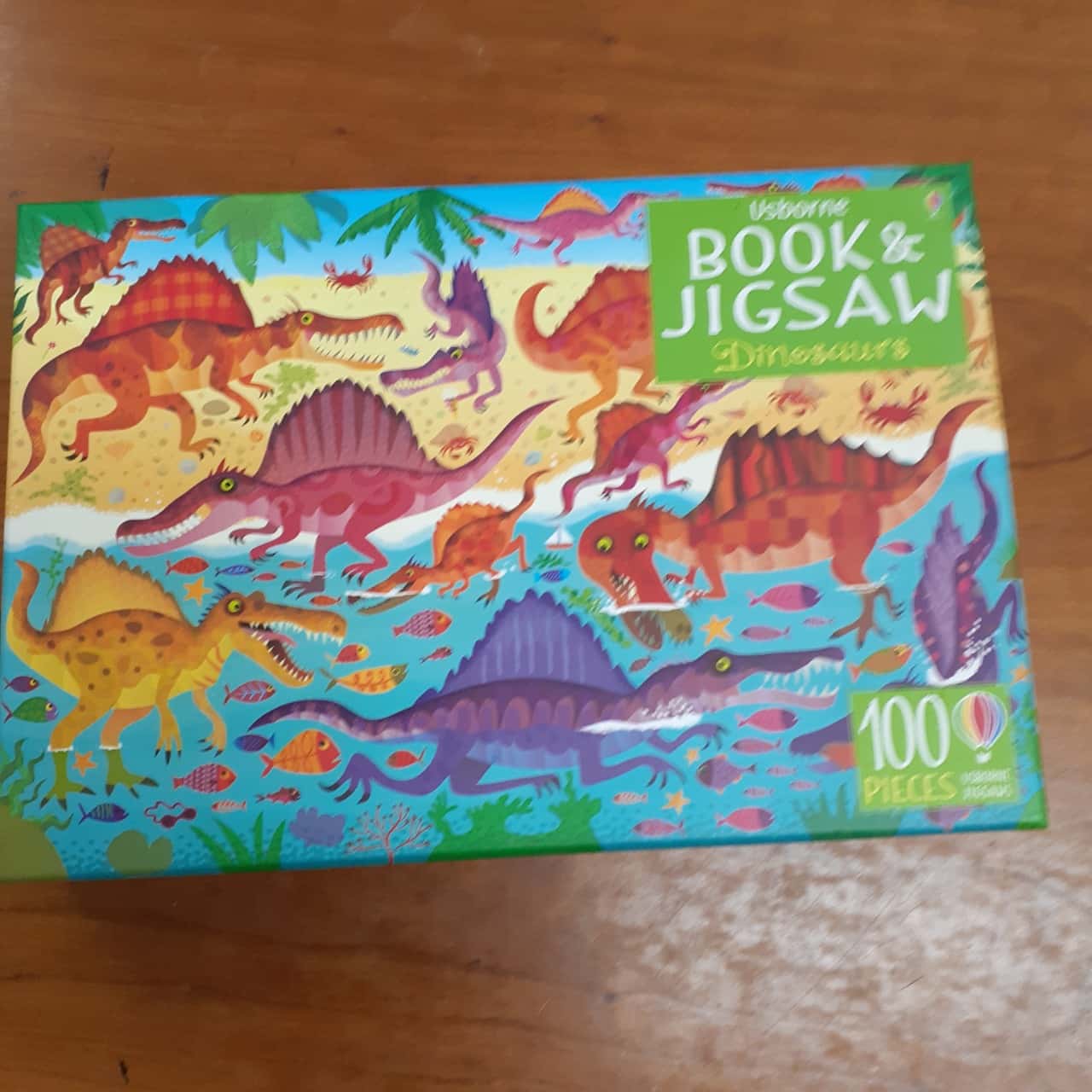 Usborne Book and Jigsaw Dinosaurs 100 pieces rrp$20