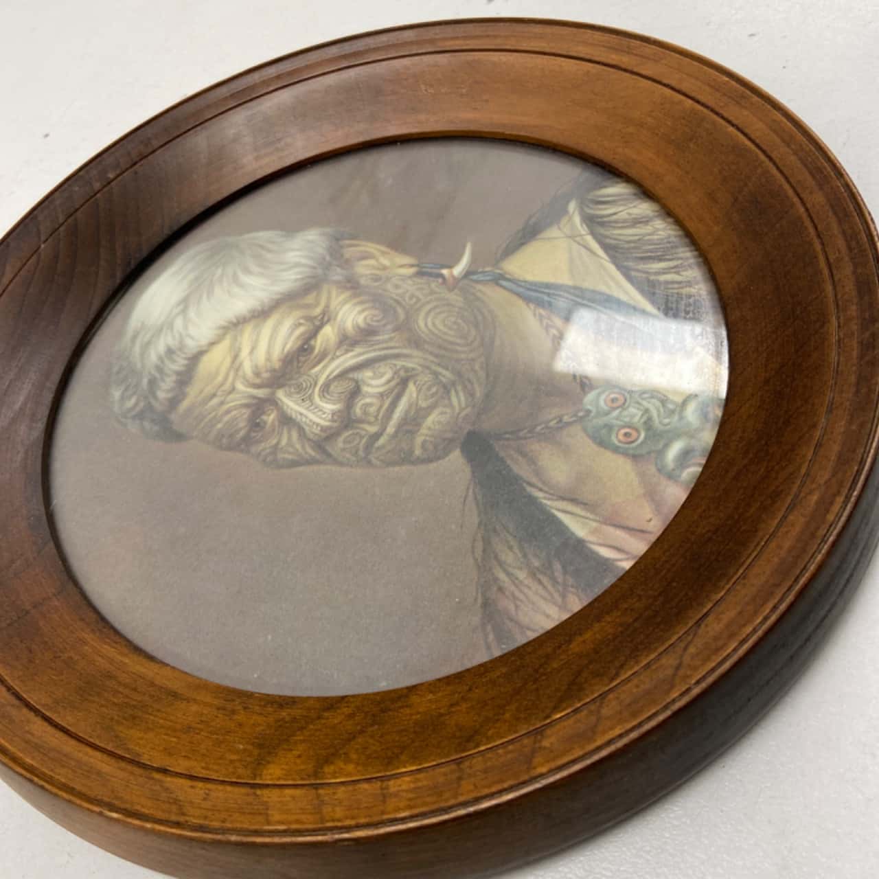Round vintage frame with Māori pic ( Haora Tips Koinaki)