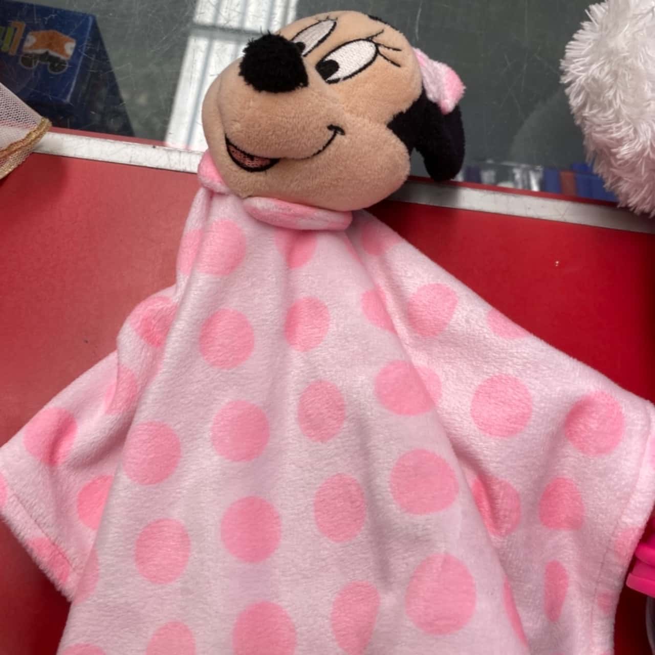 Minnie Mouse on scoter and two plush minnies