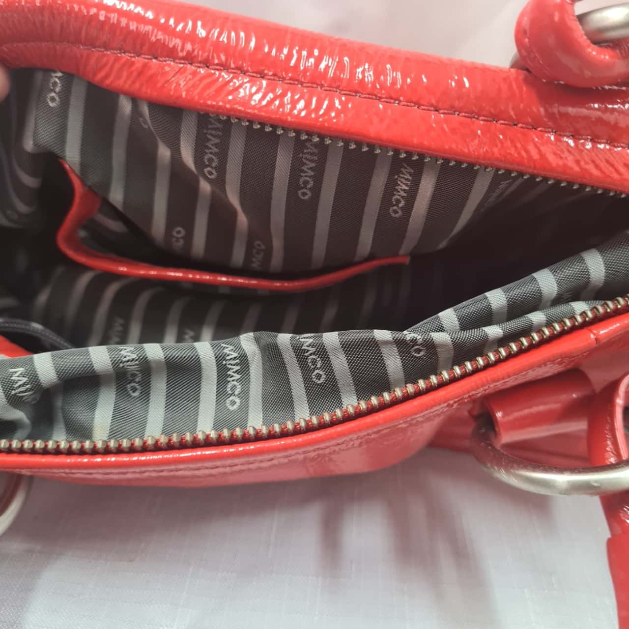 As new Mimco red patent leather handbag(s)
