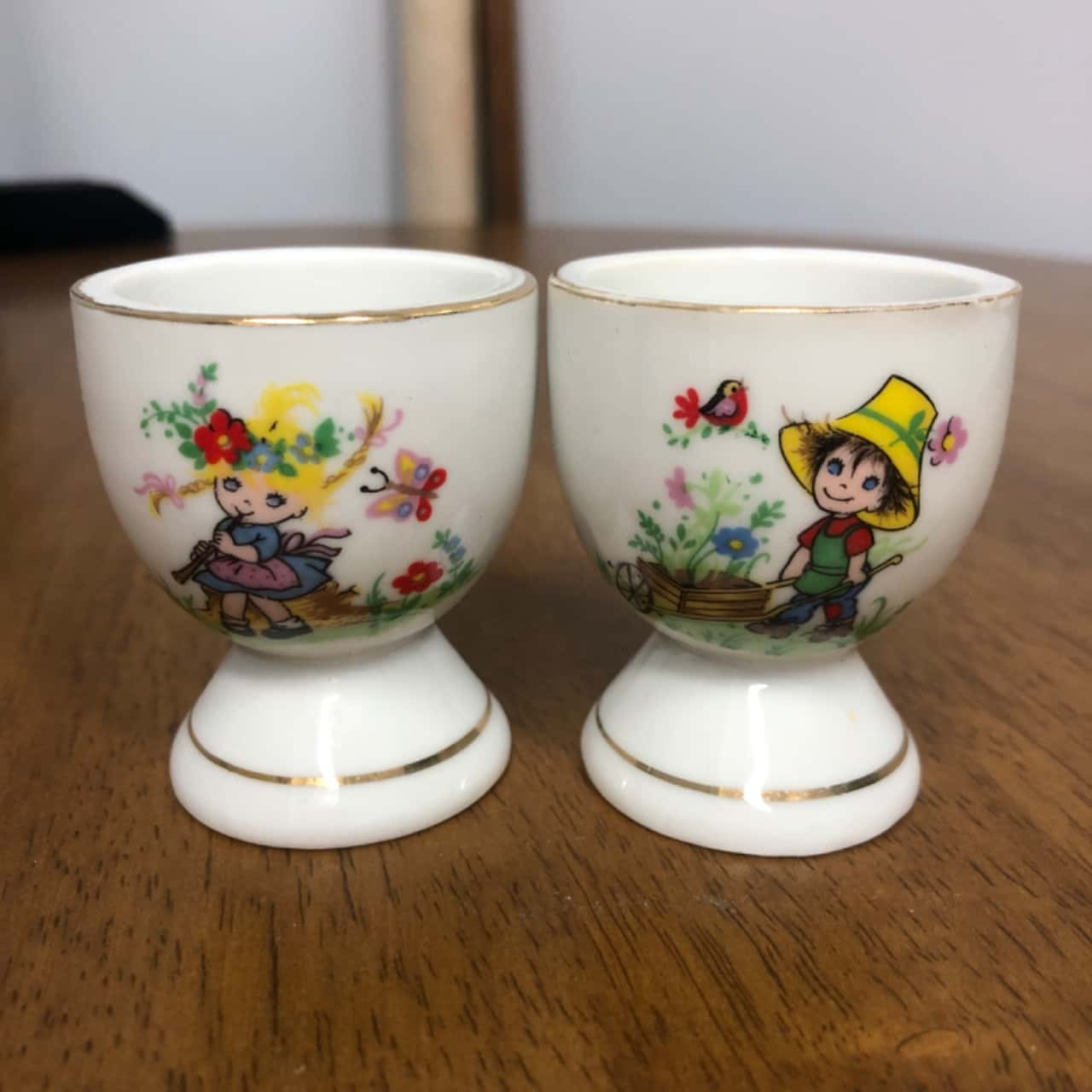 SALE! Vintage Girl & Boy ceramic egg cups with gold trim(s)