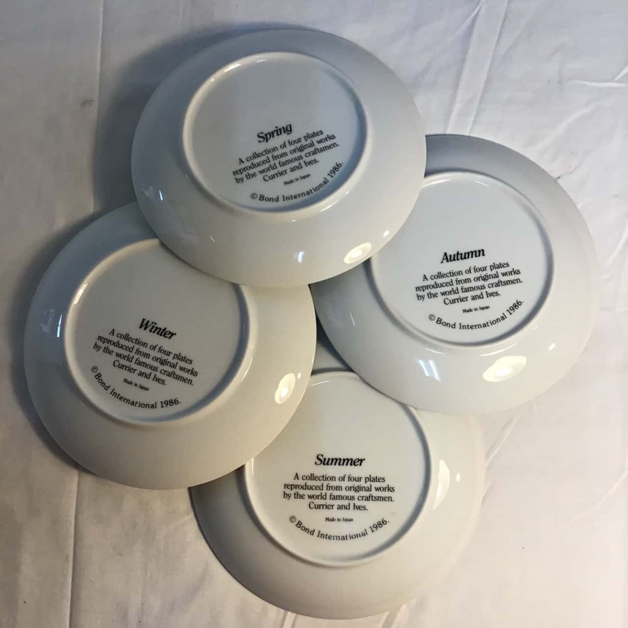 “Reduced” Set of 4 Season Vintage Bond International Plates 1986(s)
