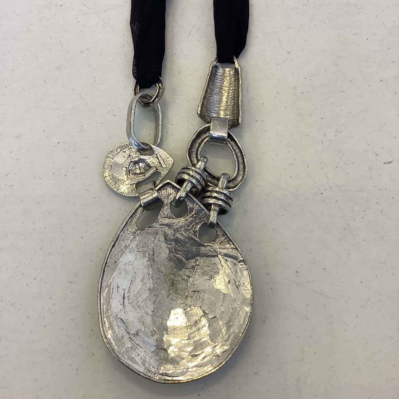 Womens Heavy Necklace with Silvertone Pendant and Fabric Strap(s)