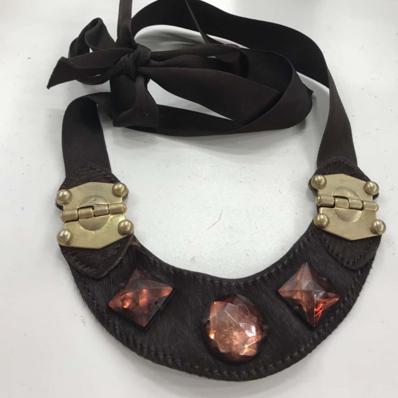 Animal fur leather necklace with brass detail