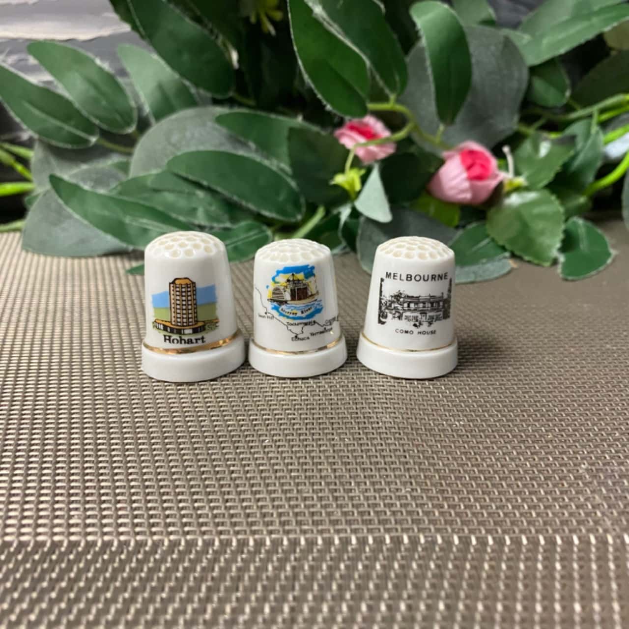 Box 4 white ceramic souvenir thimbles. Please read description