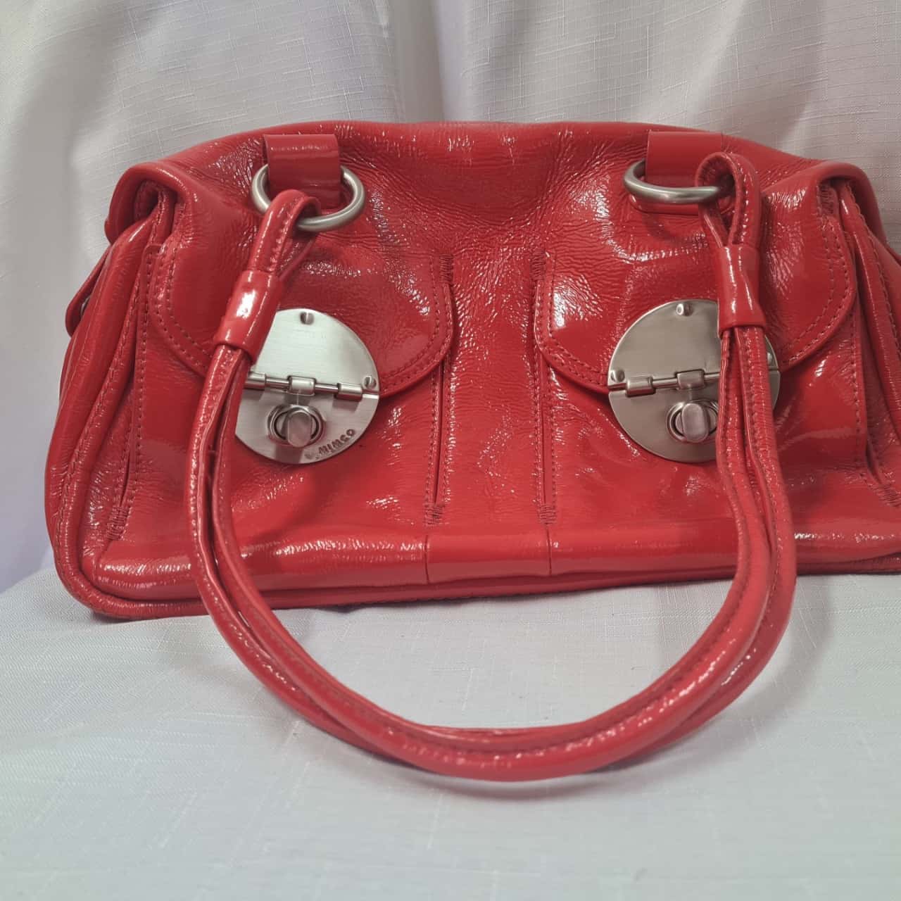 As new Mimco red patent leather handbag(s)