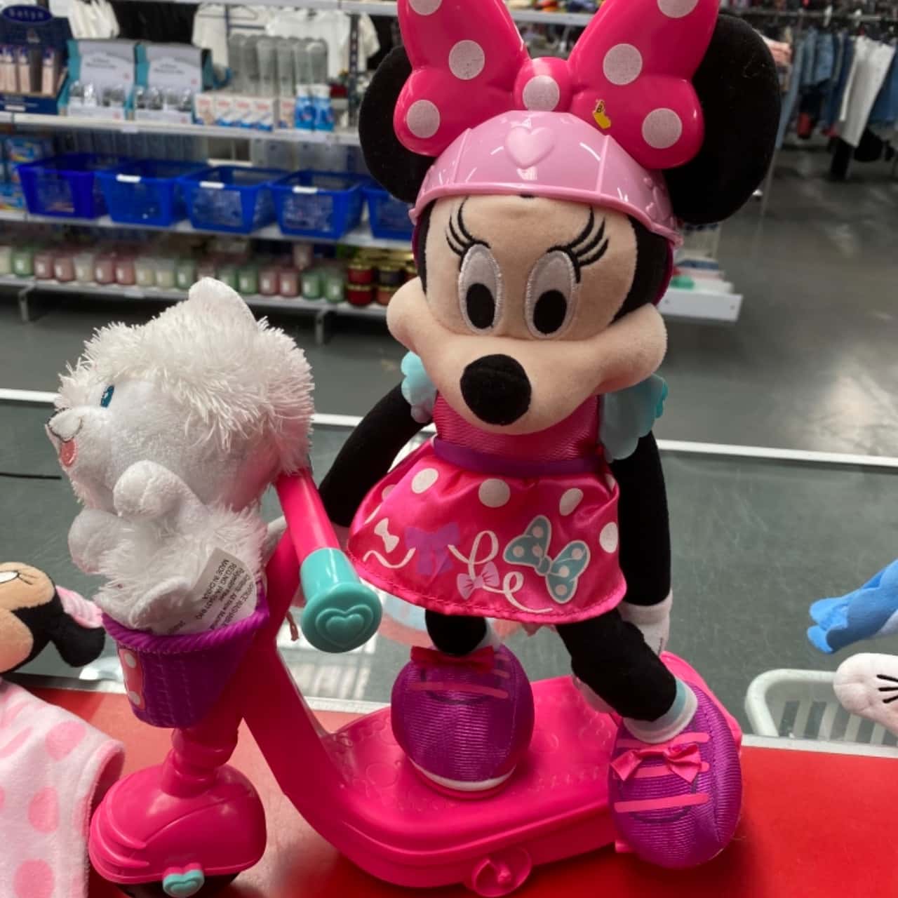 Minnie Mouse on scoter and two plush minnies