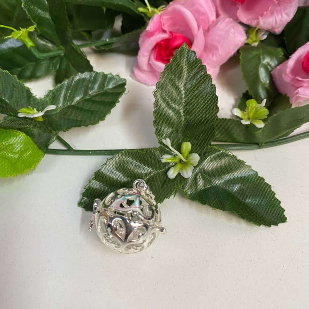 Gorgeous silver metal pendant round cage with opening (s)