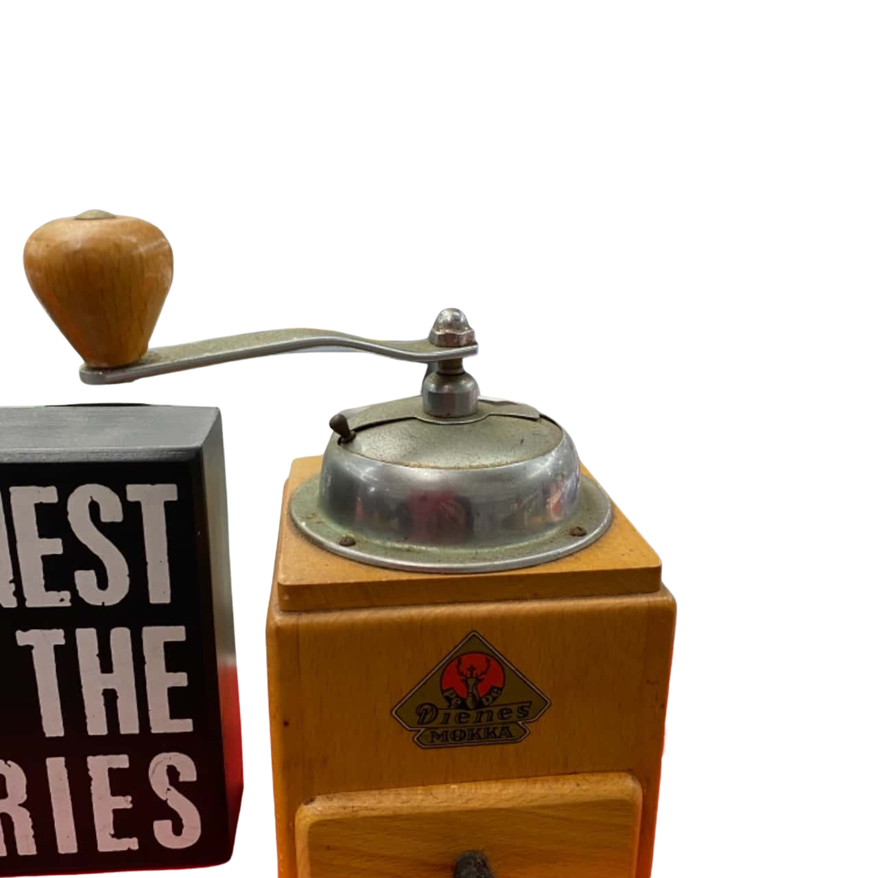 Wooden coffee grinder and sign(s)