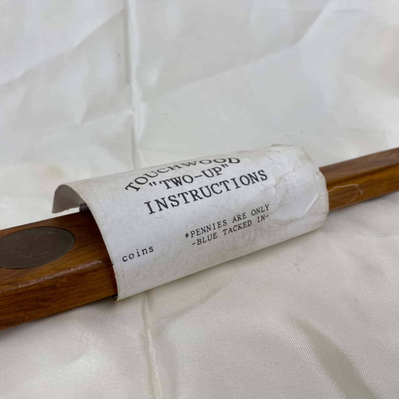 Two up game with genuine pennies