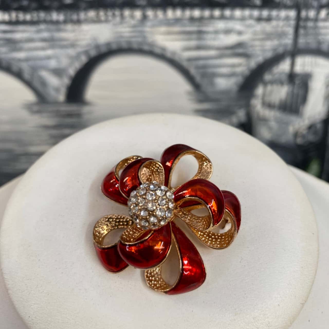 Gold tone and red diamante brooch (s)