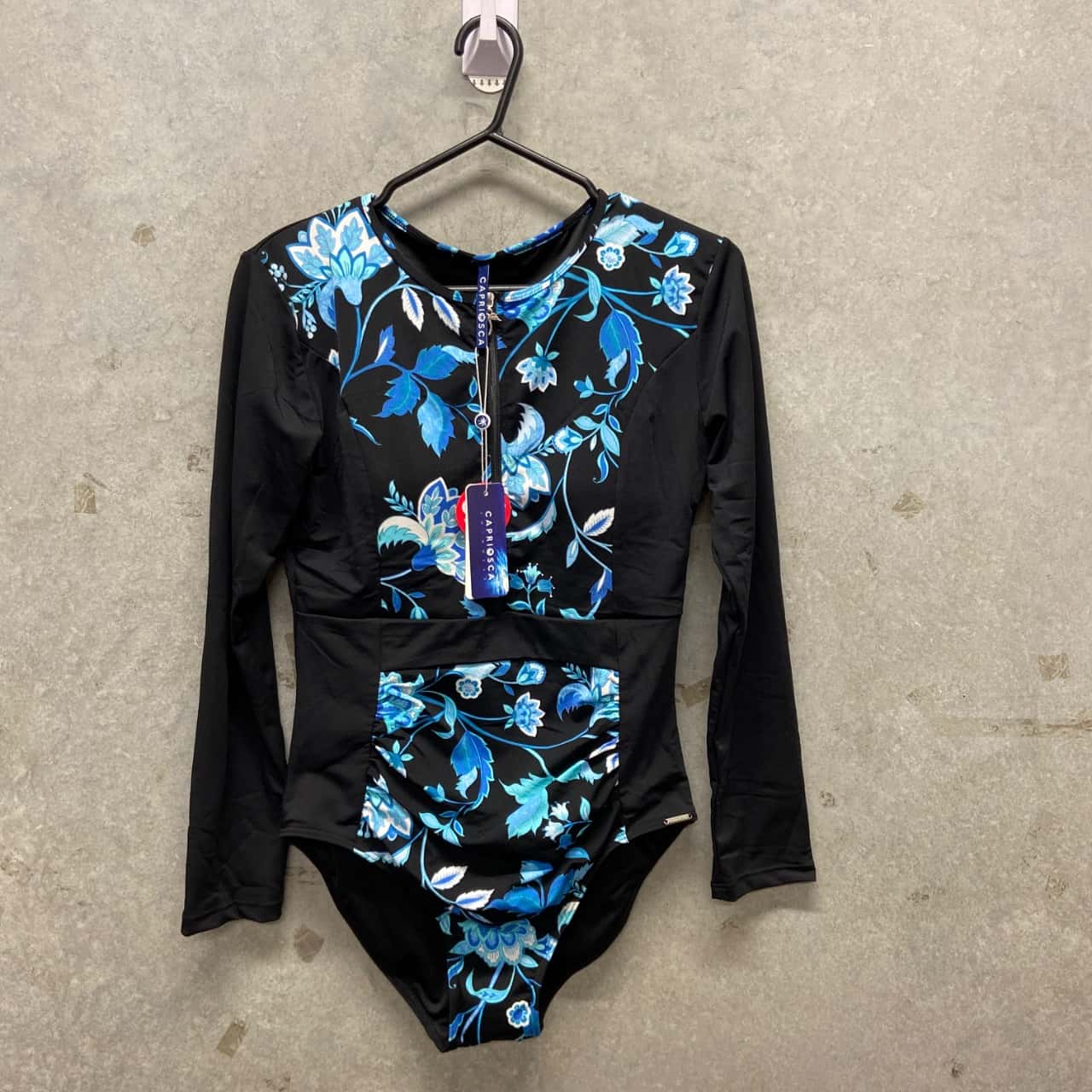 Capriosca swimwear. Long sleeve. Black with white and blue pattern(s)