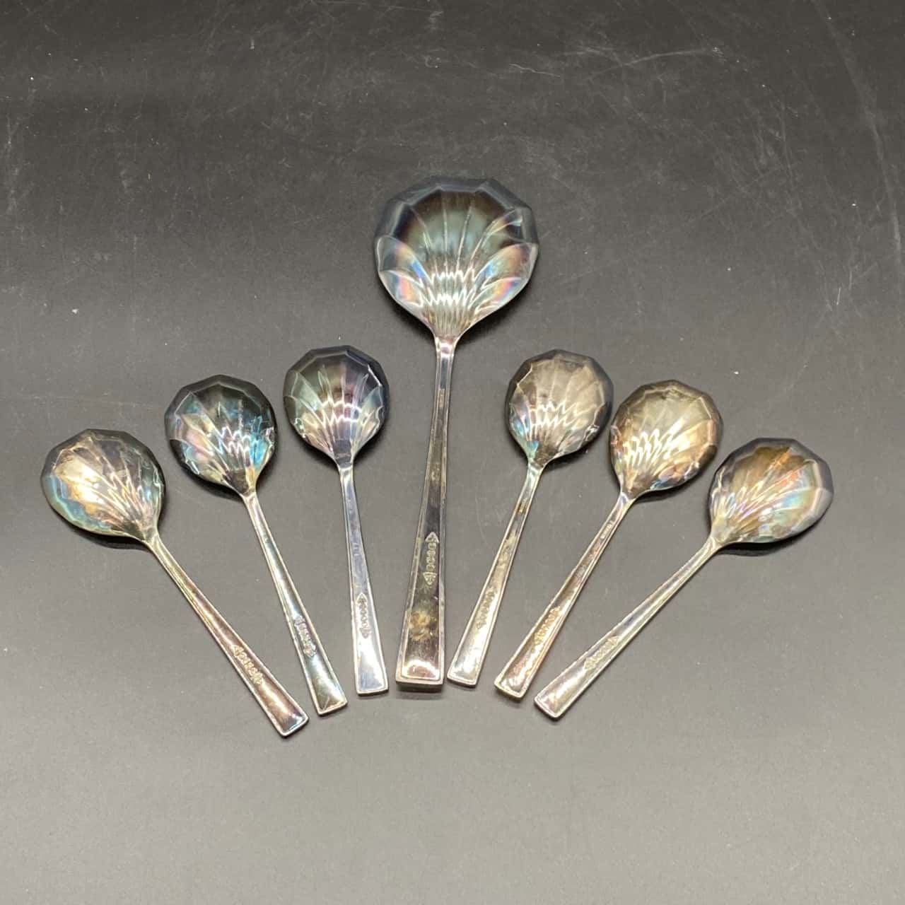 Vintage 7 piece dessert spoon set.(s)