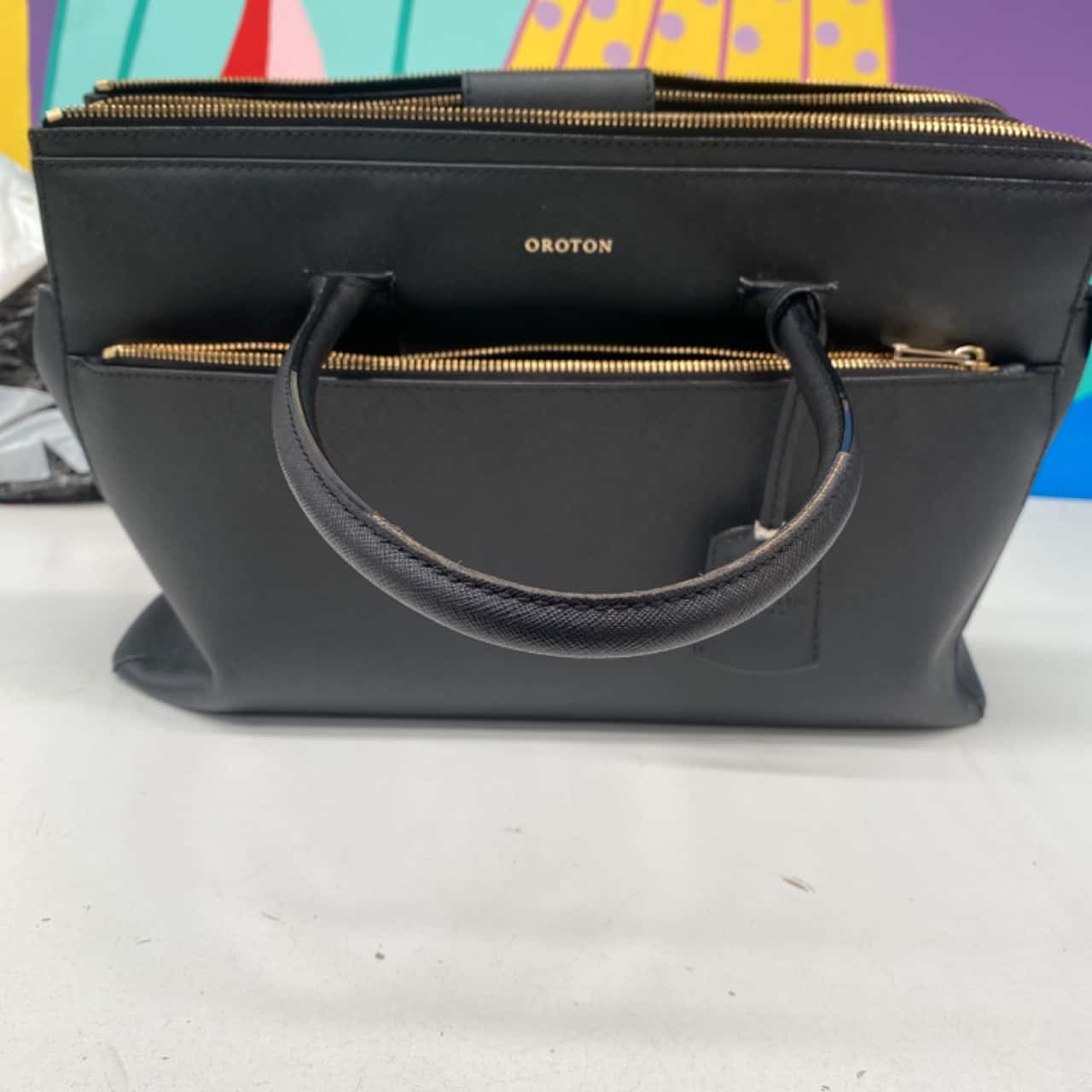 Oroton laptop bag - comes with strap (s) - Used As New | Salvos Stores