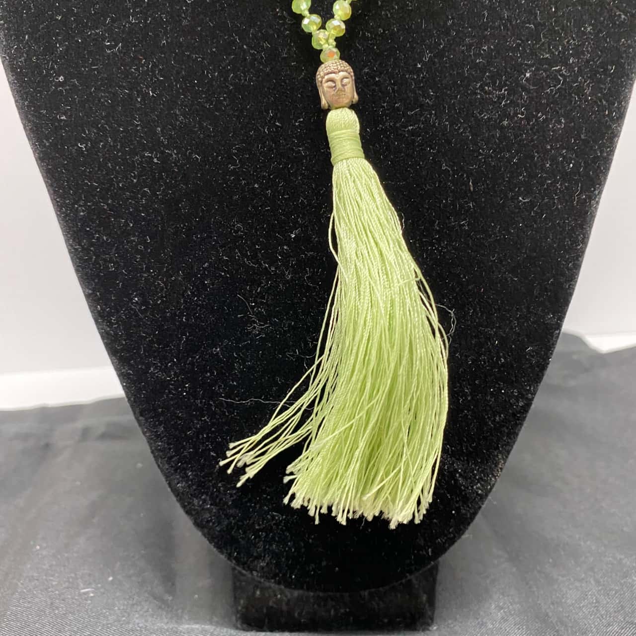 Womens Green Bead and Tassel Necklace With Feature Buddha bead.