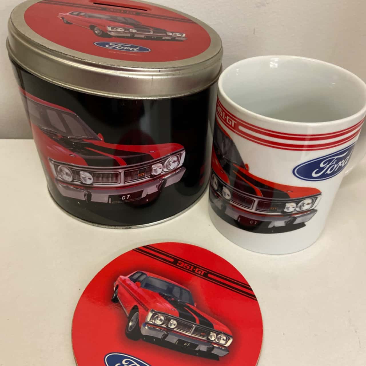 Vintage Ford GT , money box, coaster and mug.