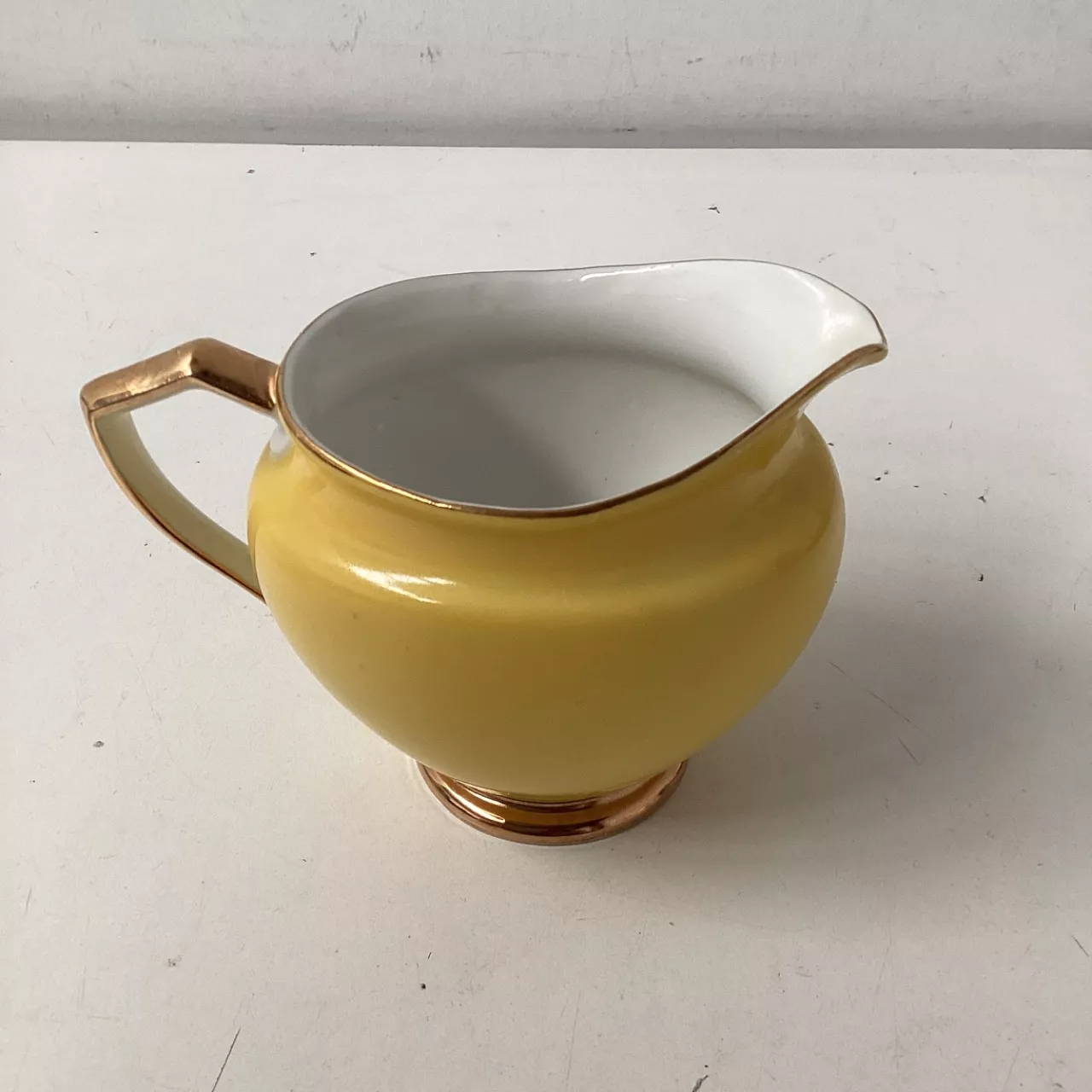 VICTORIA fine china yellow with gold trim milk jug(s)