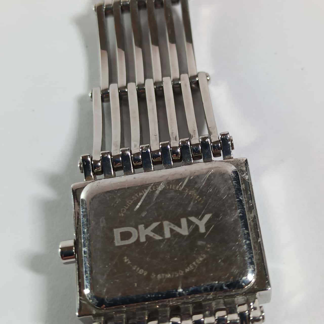 DKNY Womens Watch Silver Stripe Band, pearlesque Rectangular face (b7e)