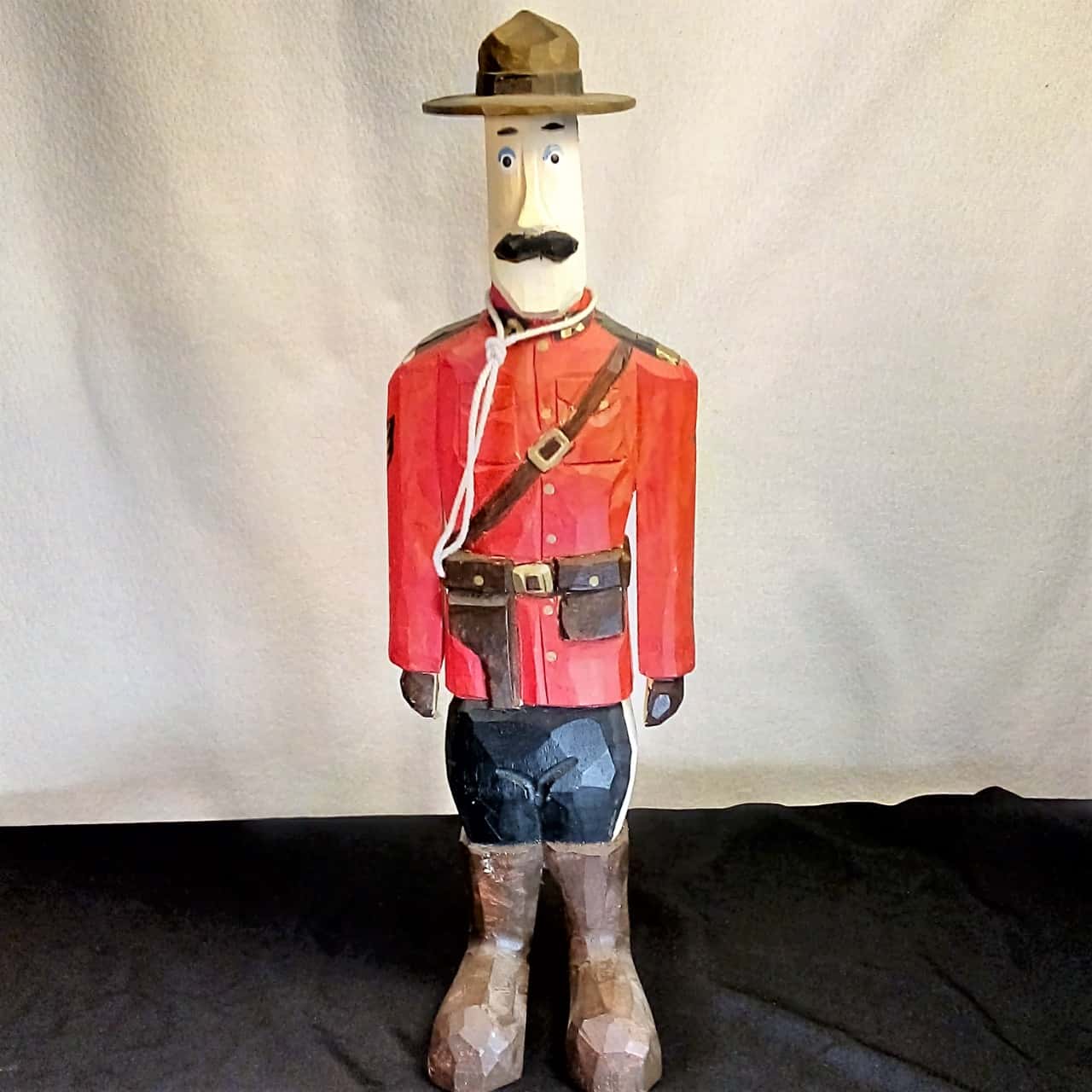 WOODEN MOUNTIE STATUE(s)