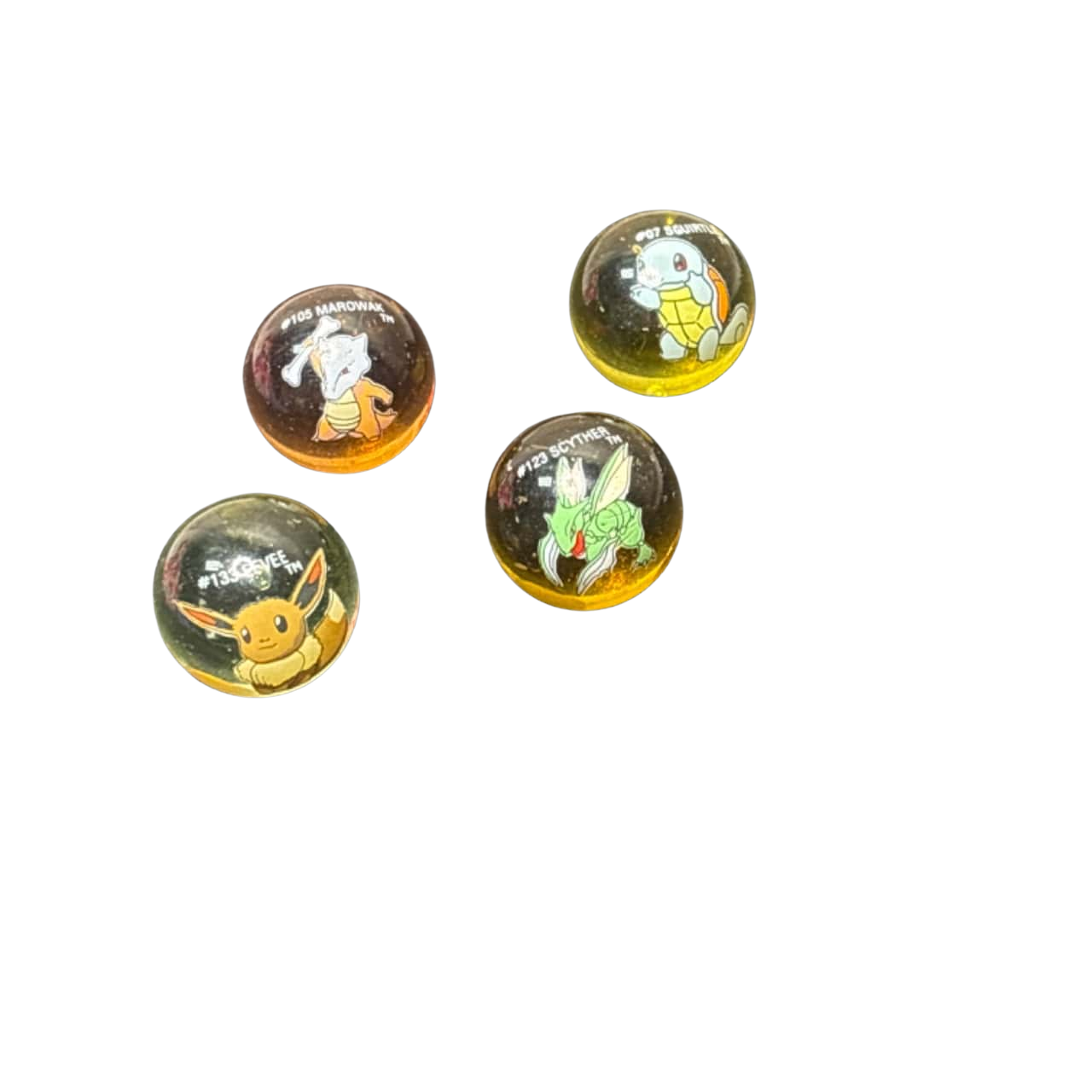 Bundle of four vintage Pokemon marbles(s)