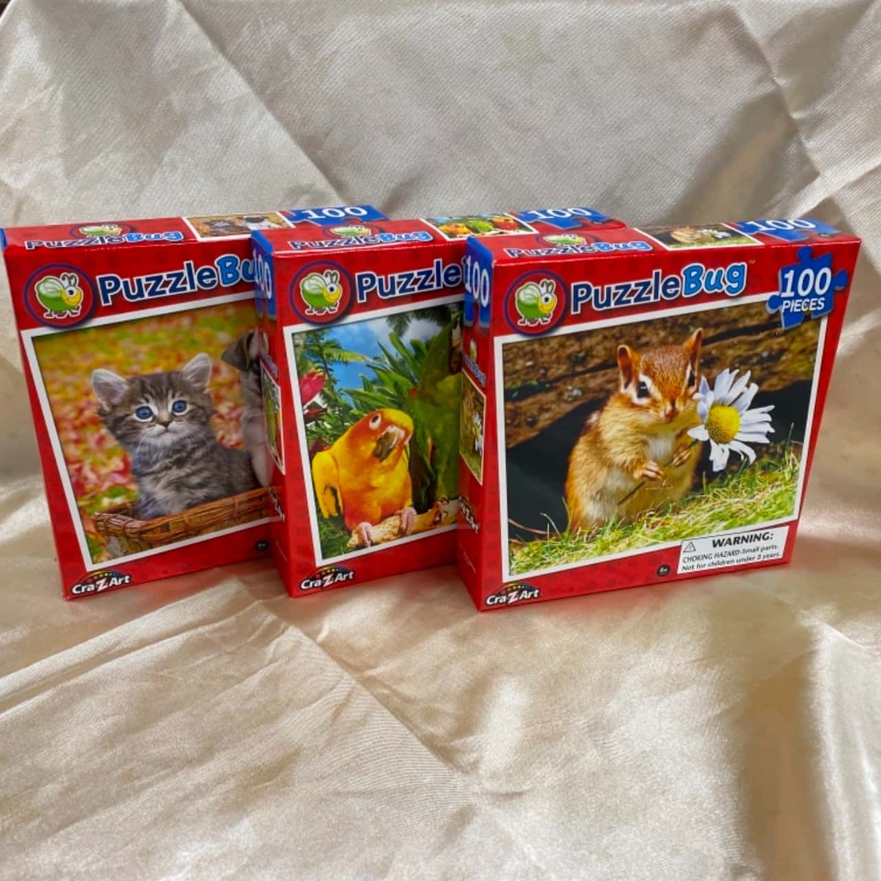 Three 100 piece Puzzle Bug Puzzles(s)