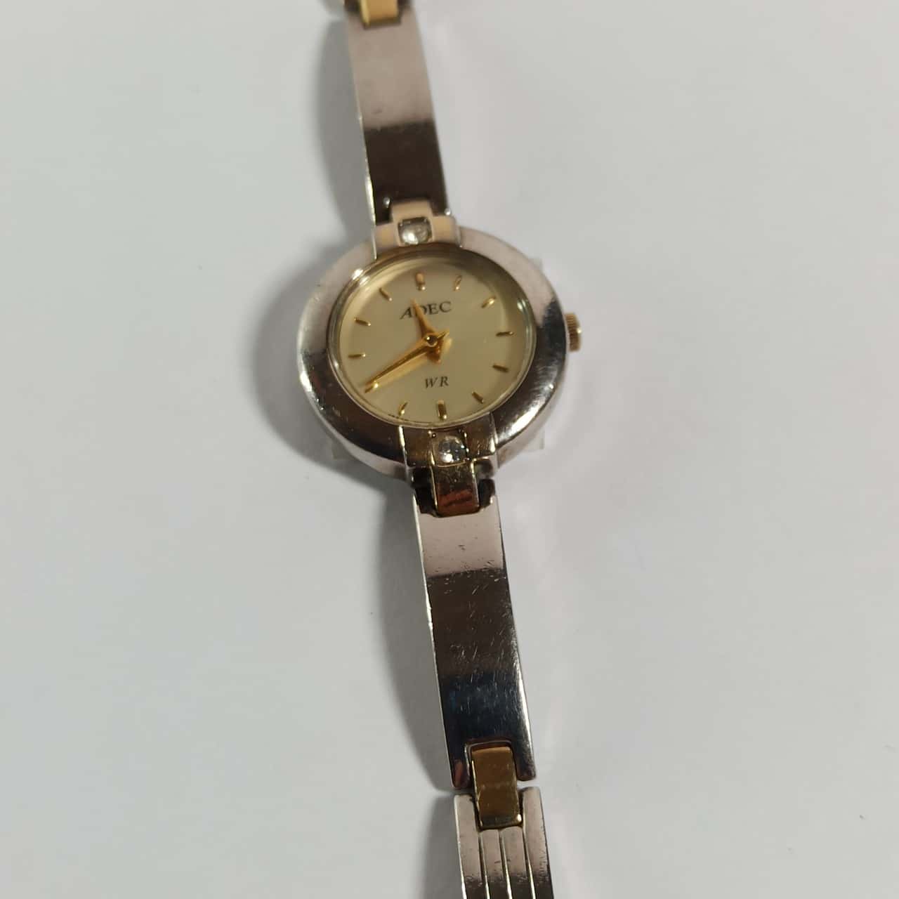 Citizen/Adec Womens Small Silver Round face watch with bling. Metal band