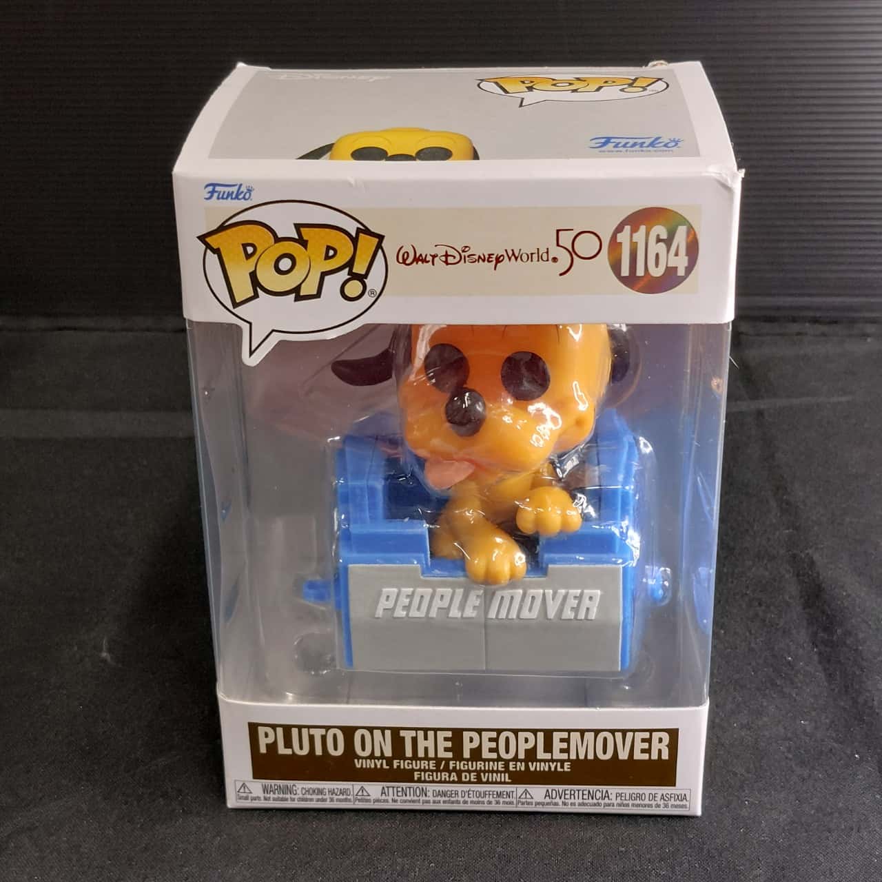 Walt Disney World 50 funko pop pluto on the peoplemover vinyl.