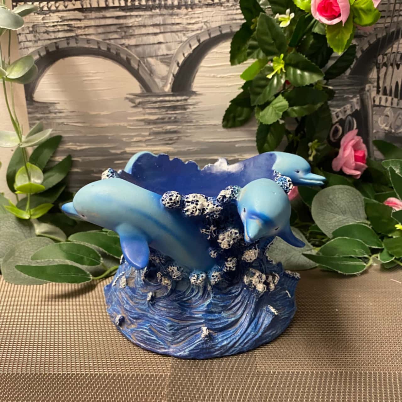 Dolphin statue candle holder