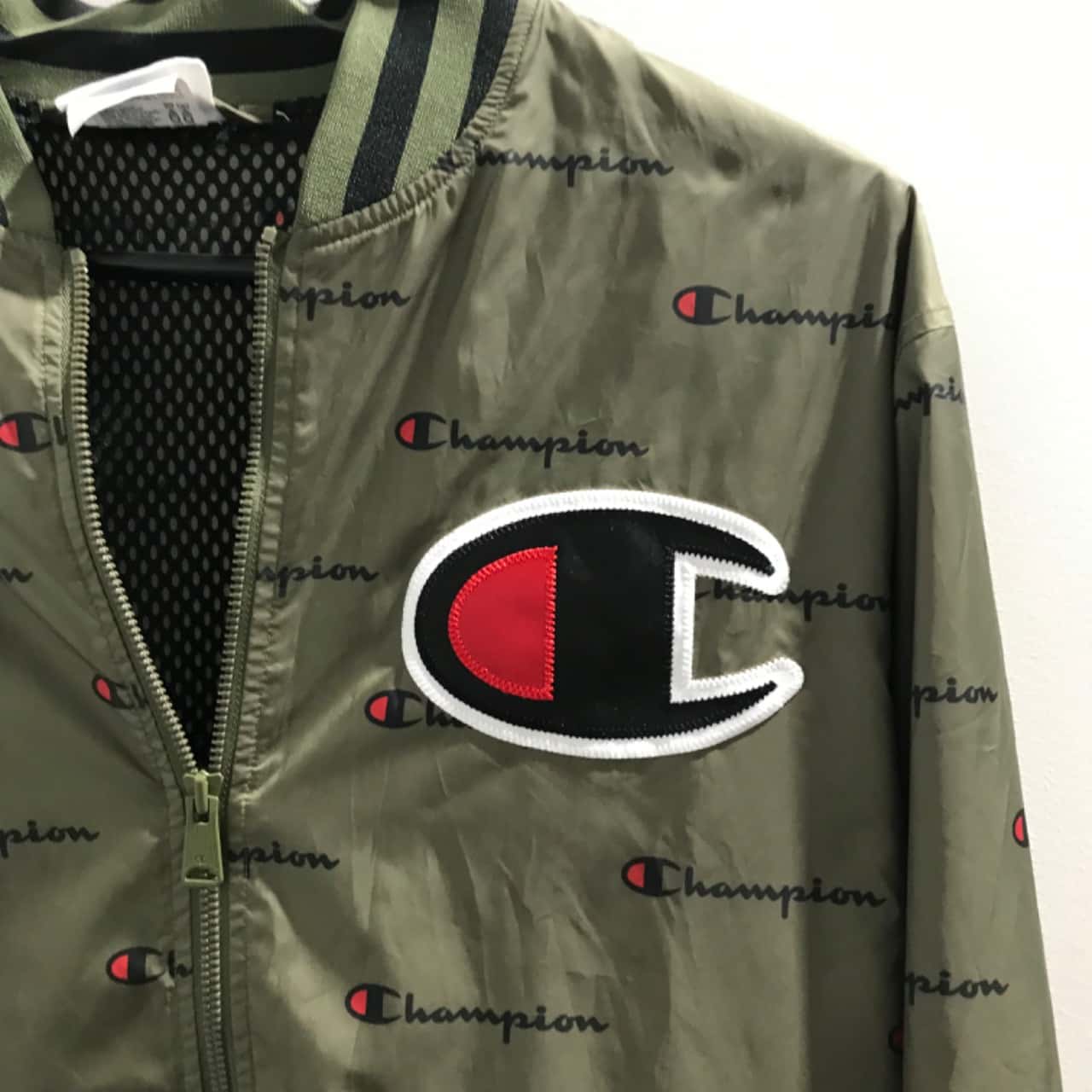 Champion. Unisex. Size XL, Bomber Jacket. Khaki with 'Champion' written ...