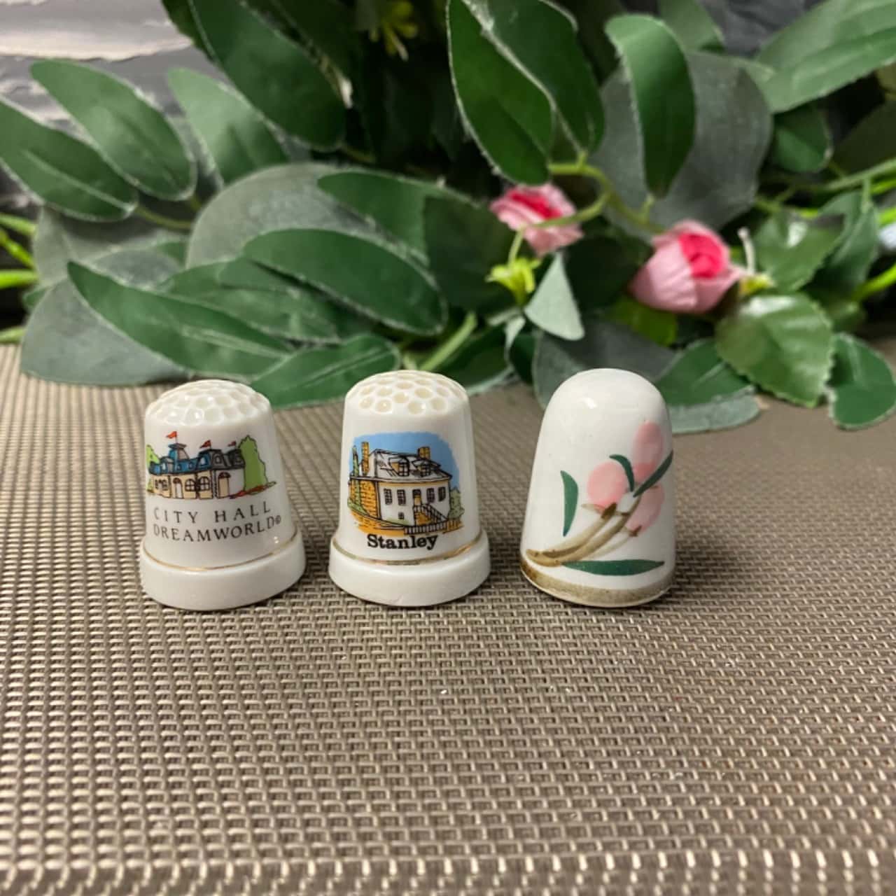 Box 4 white ceramic souvenir thimbles. Please read description