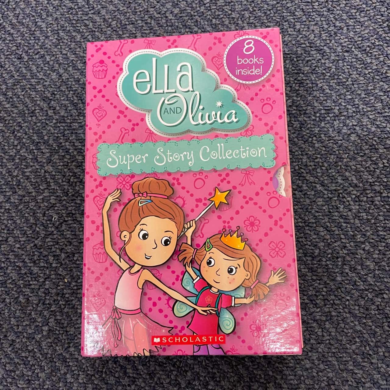 Ella and Olivia. 8 soft cover books in cardboard case. Good condition(s)