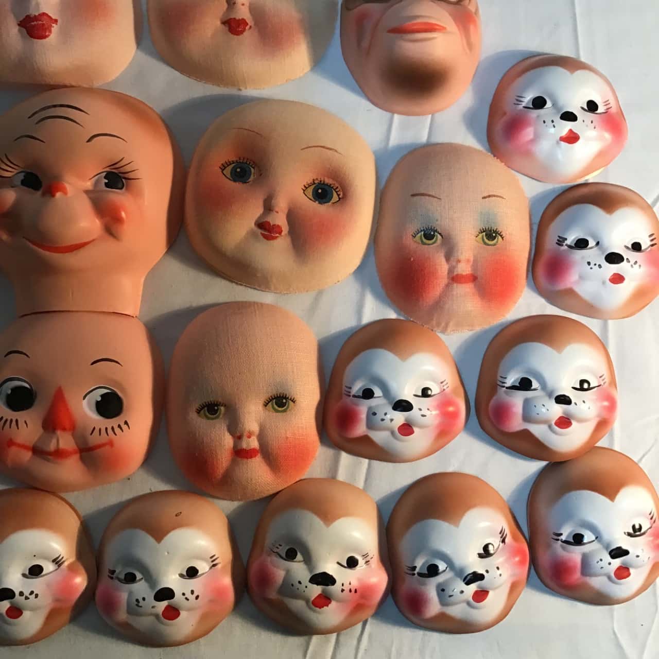 25 assorted Doll faces(s)